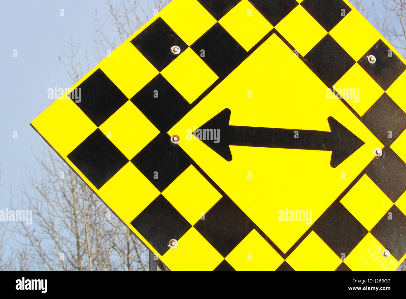Sharp left arrow road sign hi-res stock photography and images - Alamy