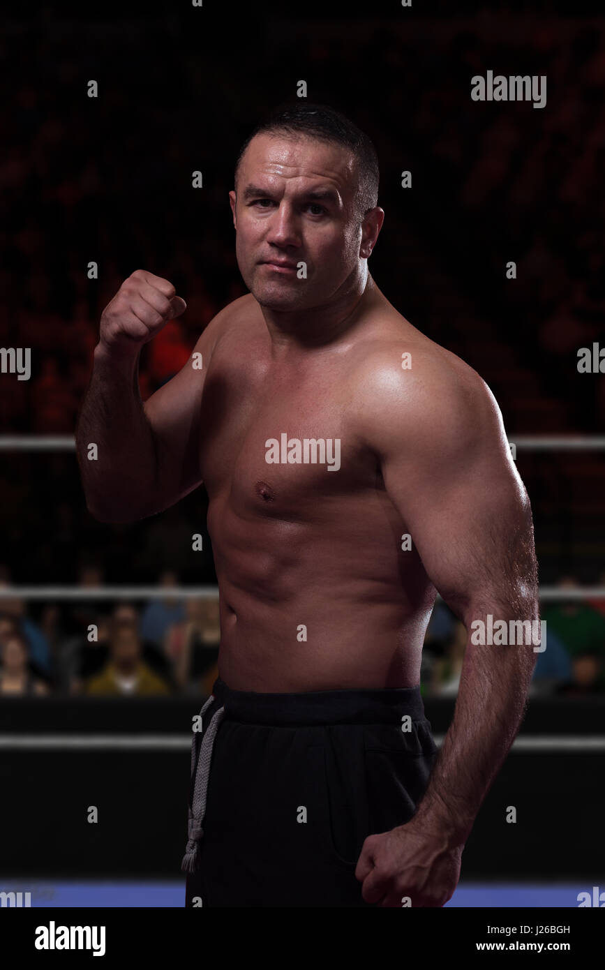 professional kickboxer with hands in martial arts position training for ...