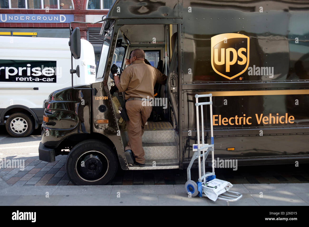 Brown UPS electric delivery vehicle Stock Photo - Alamy