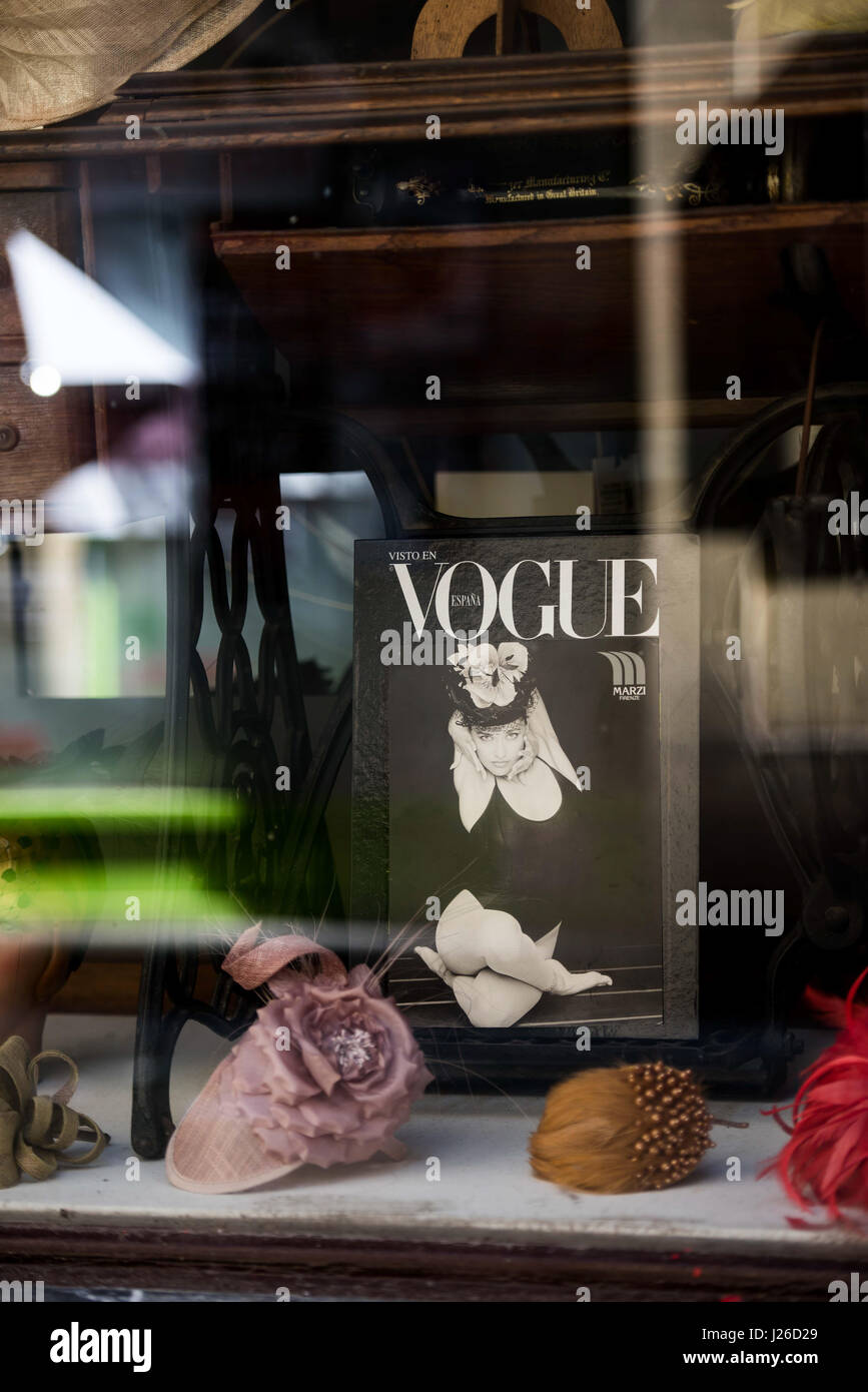 Historical Vogue magazine behind window store Stock Photo - Alamy