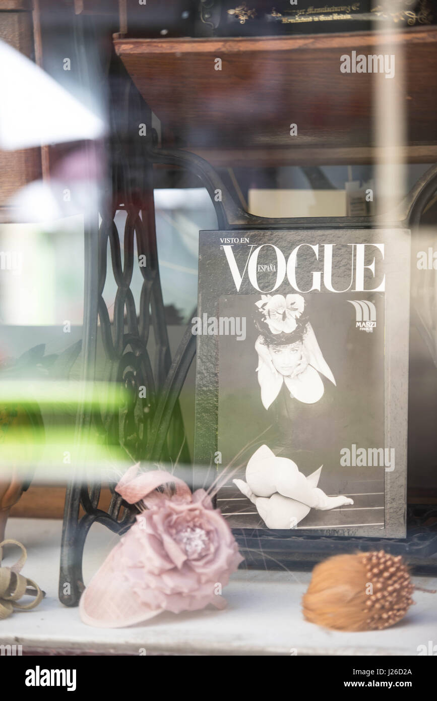 Historical Vogue magazine behind window store Stock Photo - Alamy