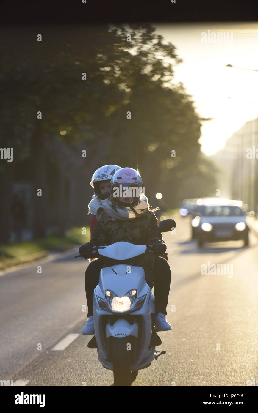 Scooter riding on a street Stock Photo - Alamy