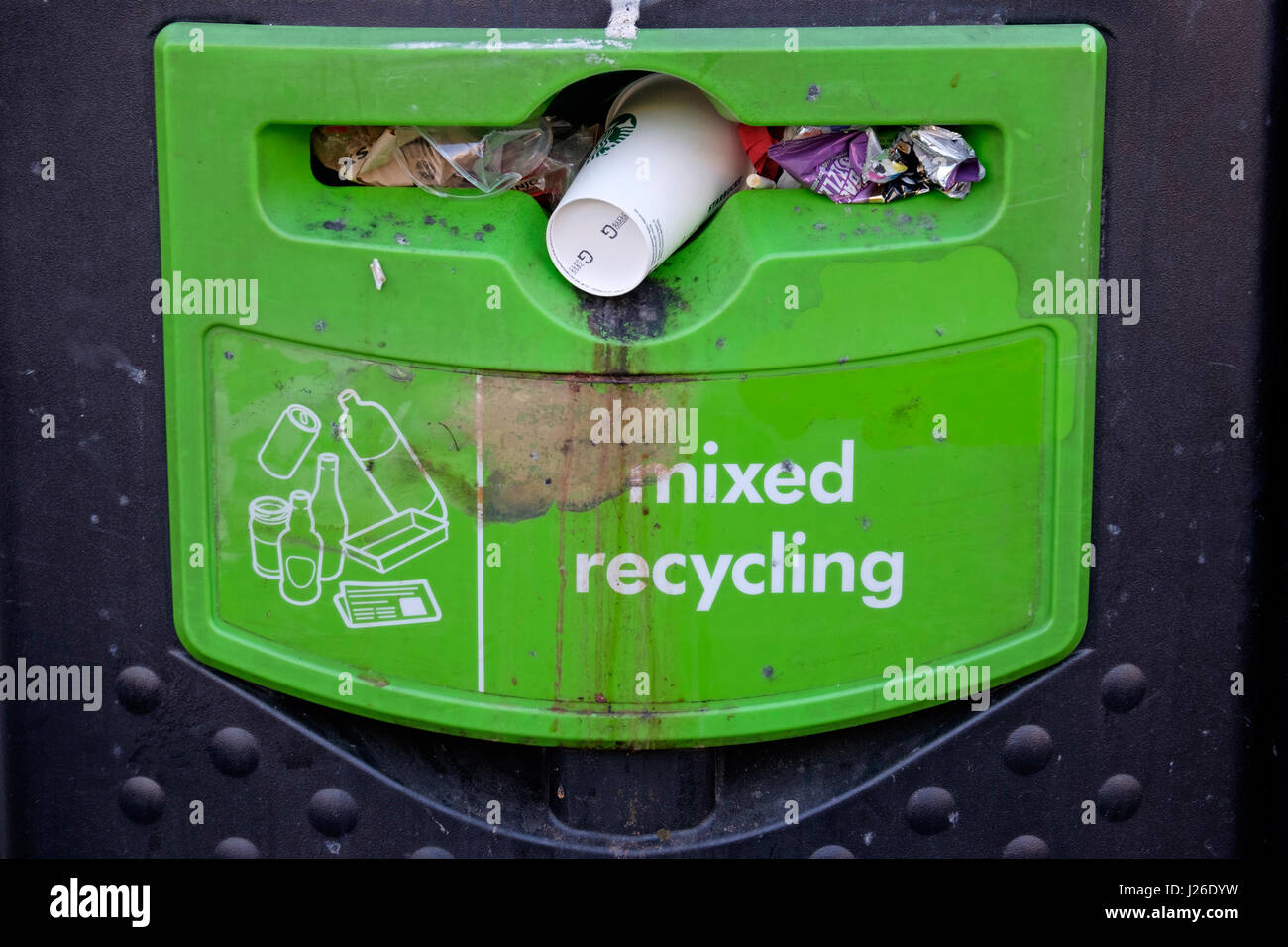Mixed recycling bin overflowing with trash Stock Photo - Alamy