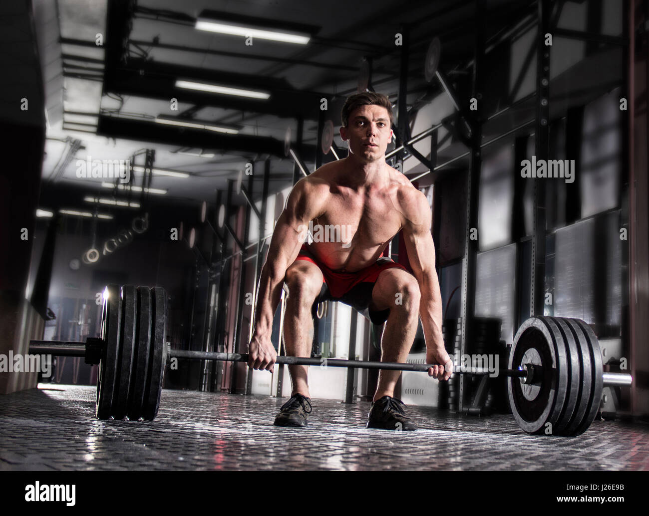 Young shirtless man doing deadlift exercise at gym Stock Photo - Alamy