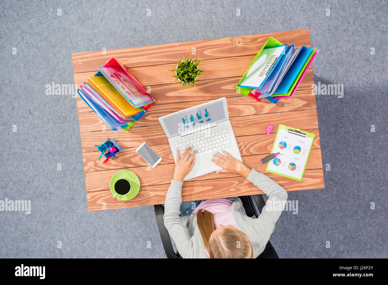 Overhead shot of woman working on computer in office Stock Photo - Alamy