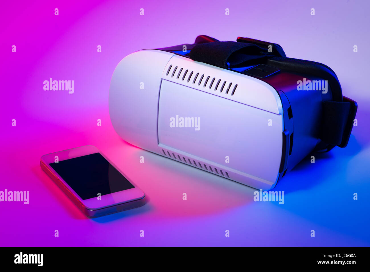 VR virtual reality goggles cellphone headset on colorful background ...