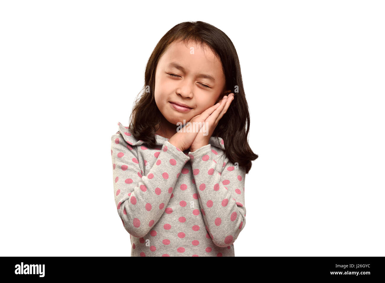 Beautiful asian kid napping with her hands isolated over white ...