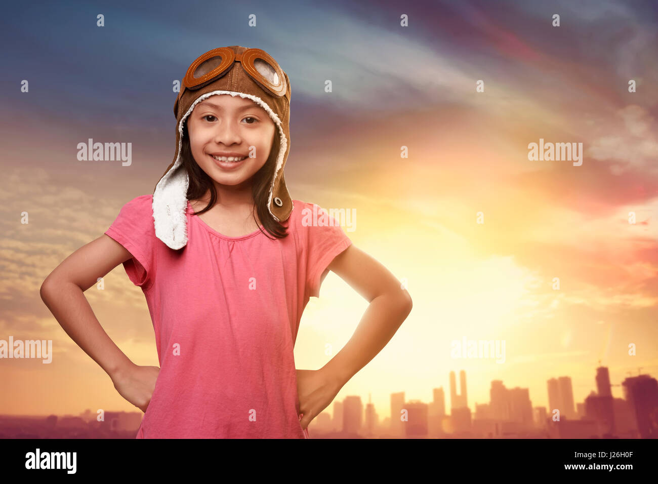 Funny asian kid with aviator hat dreaming of becoming a pilot against ...