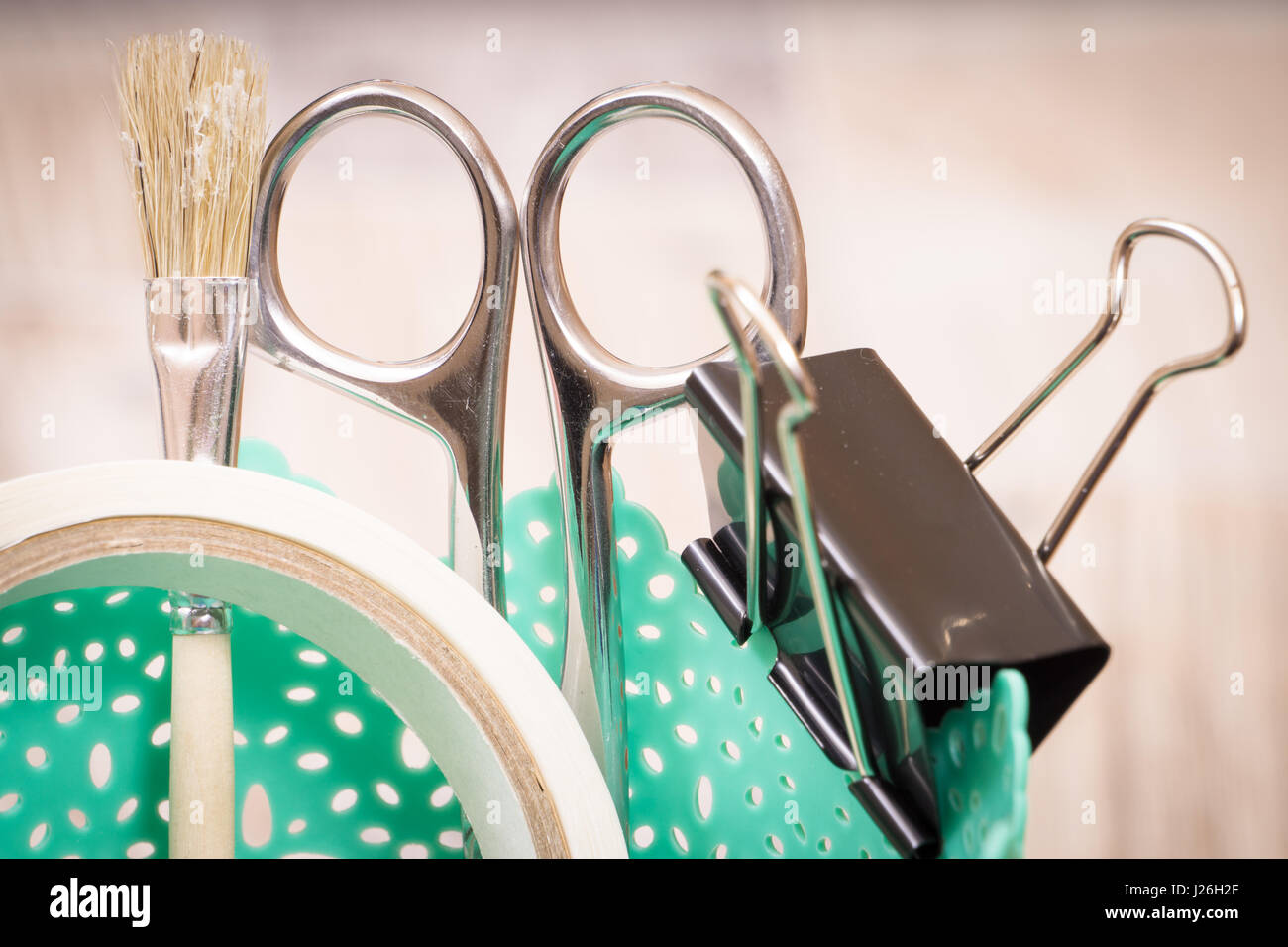 Colorful baskets, tapes and laces, and other tools for scrapbooking and ...