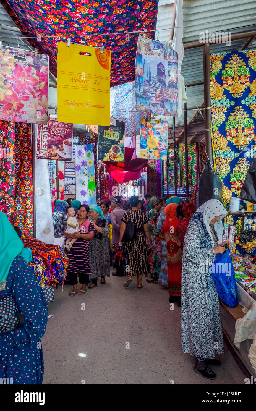 MARGILAN, UZBEKISTAN - AUGUST 21: Crowd of people walking thru the ...