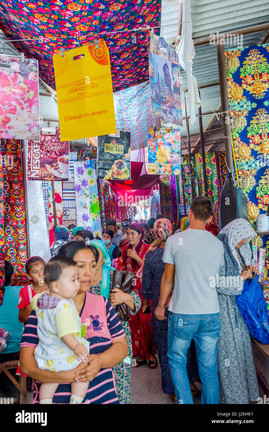 MARGILAN, UZBEKISTAN - AUGUST 21: Crowd of people walking thru the ...