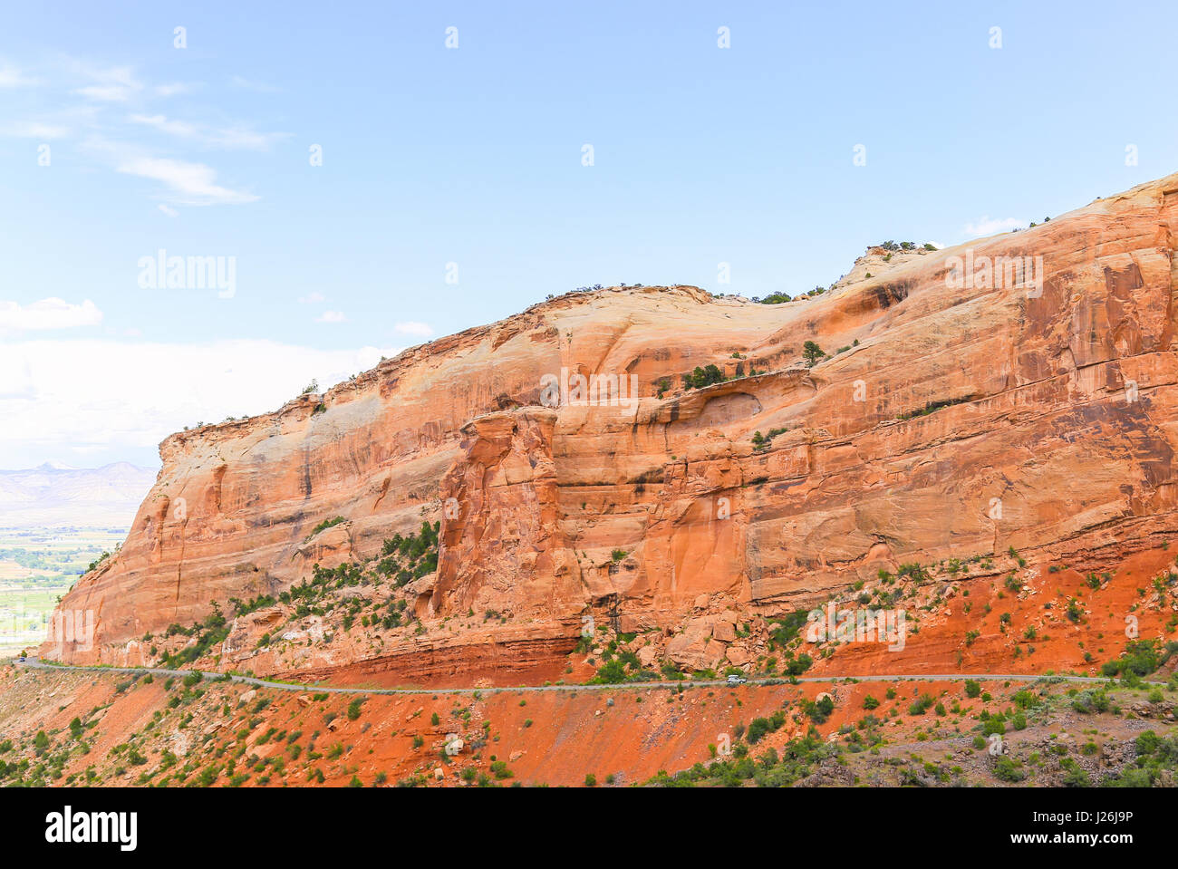 Cars driving on the Rim Rock Drive, the road going through the Colorado ...
