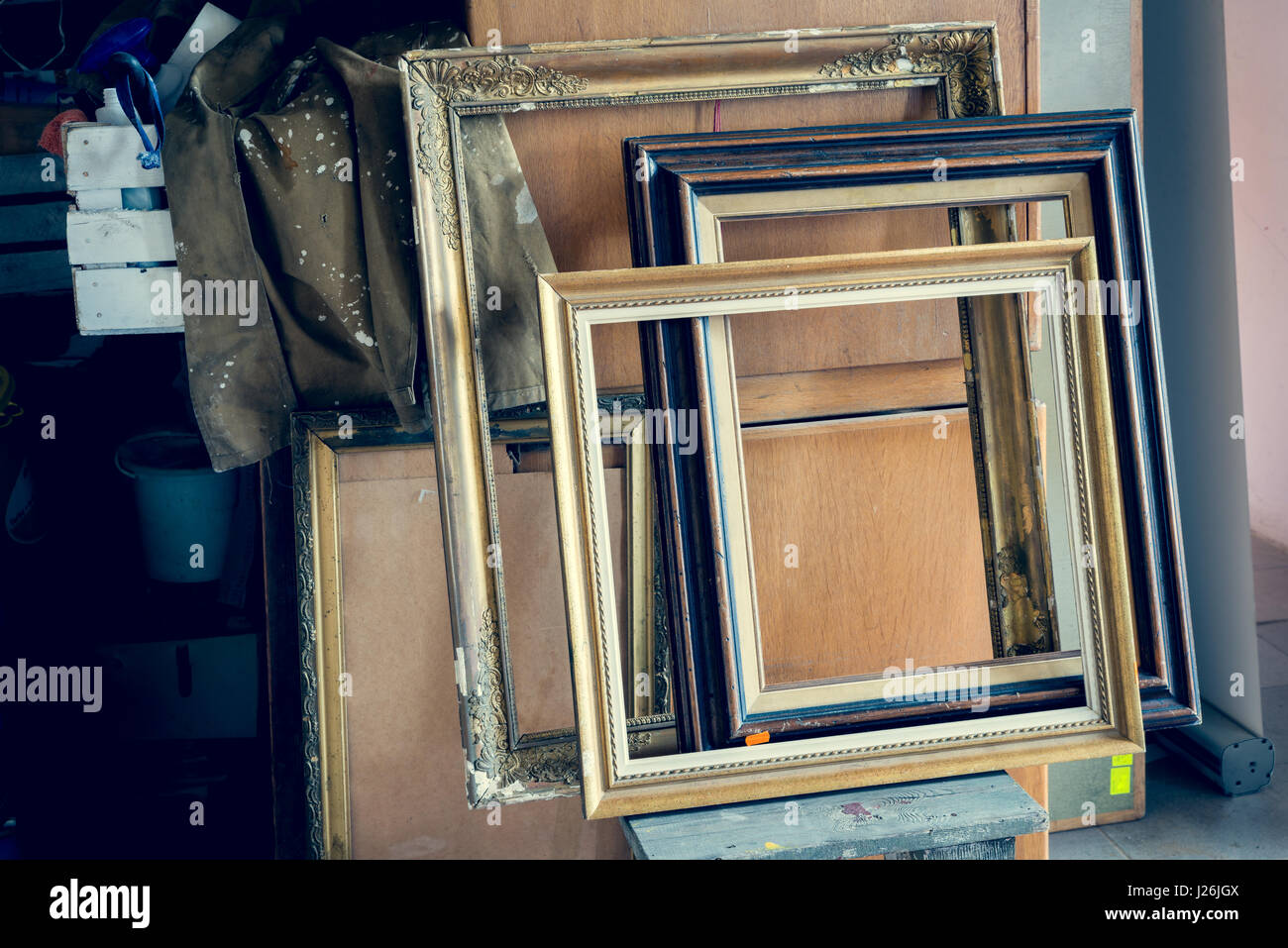 Old wooden painting frames in painter studio Stock Photo - Alamy