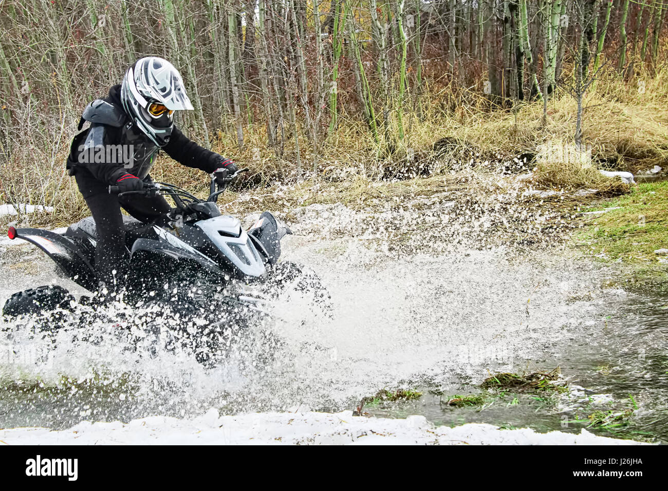 Child quading through water in spring Stock Photo - Alamy