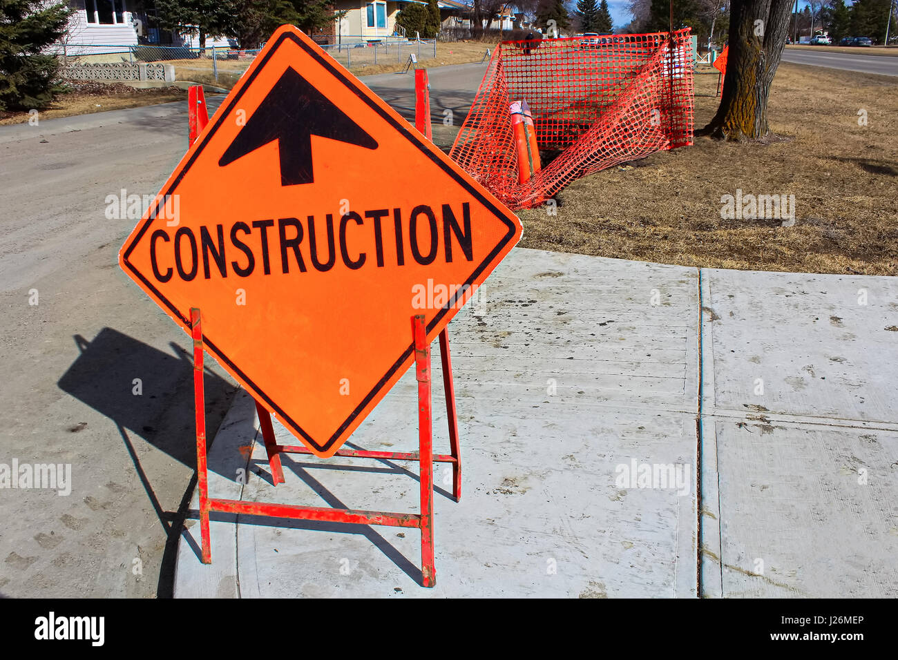 Temporary construction ahead sign on a sidewalk Stock Photo - Alamy
