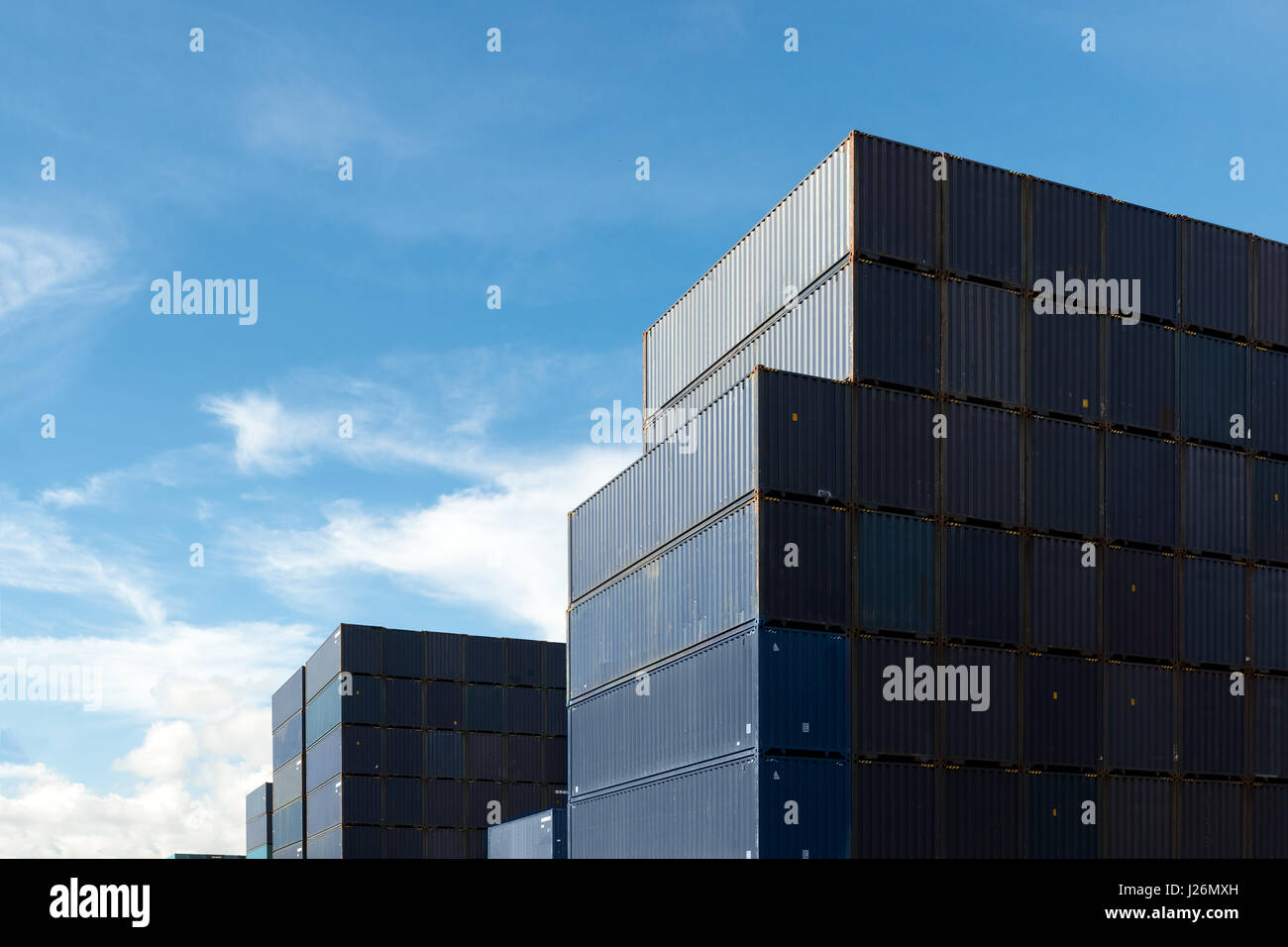 Stack of cargo containers at import and export area at port Stock Photo ...