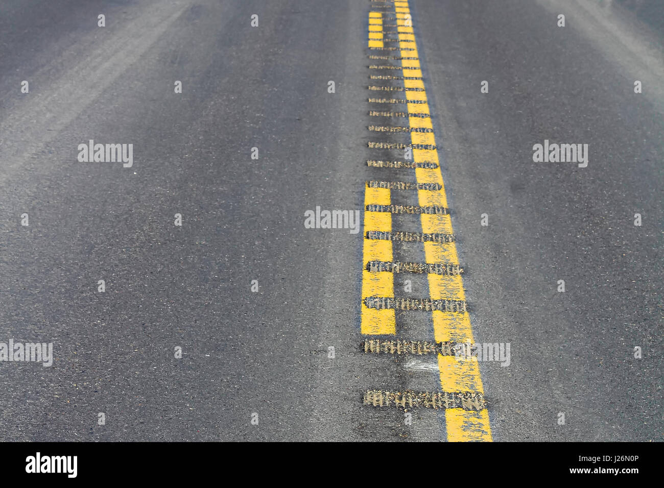 Closeup view of center rumble strips on a highway Stock Photo - Alamy