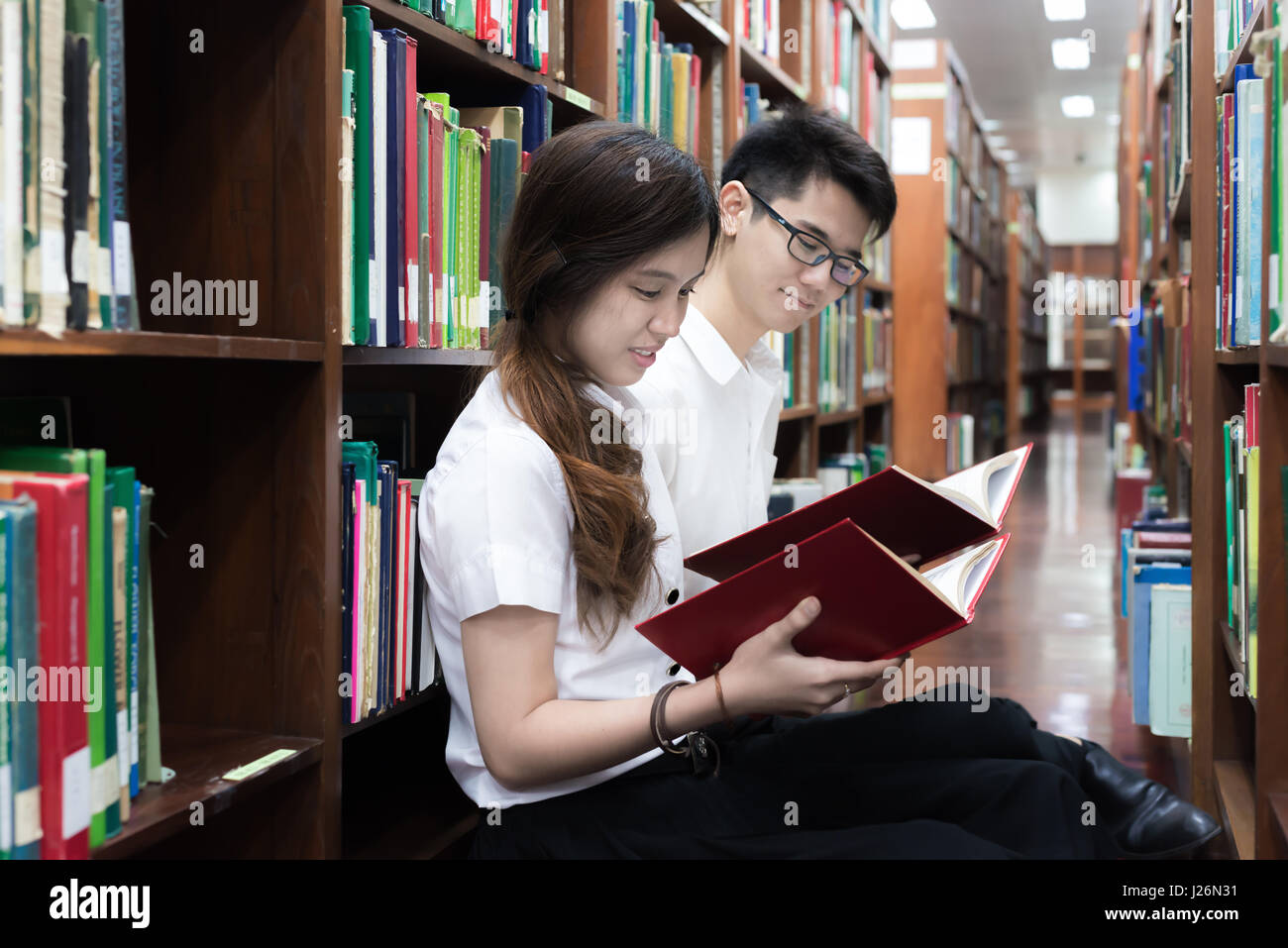Portrait of Asian couple students studying in library. Asian couple ...
