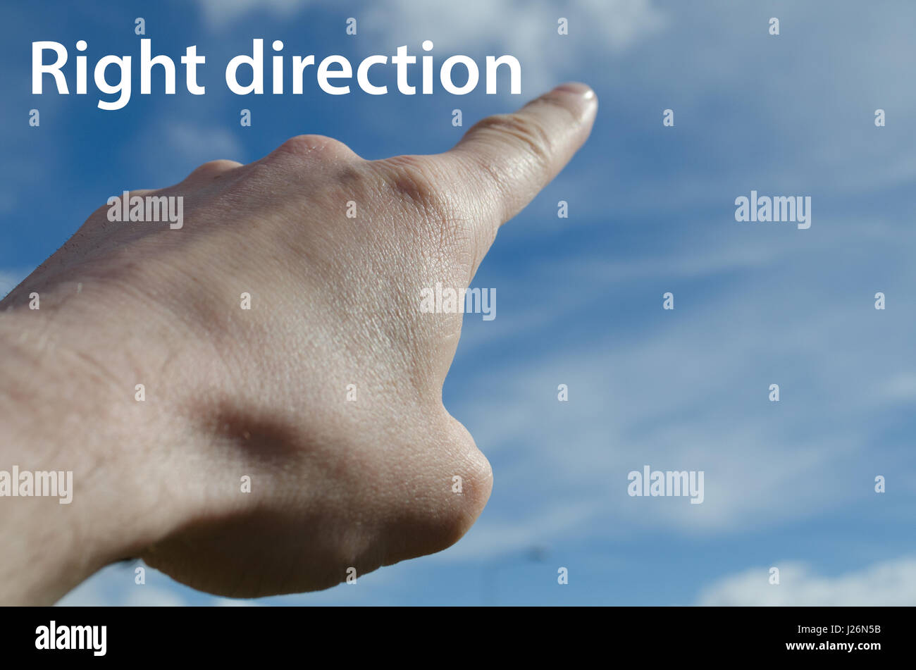 Finger pointing towards blue sky right direction concept Stock Photo ...