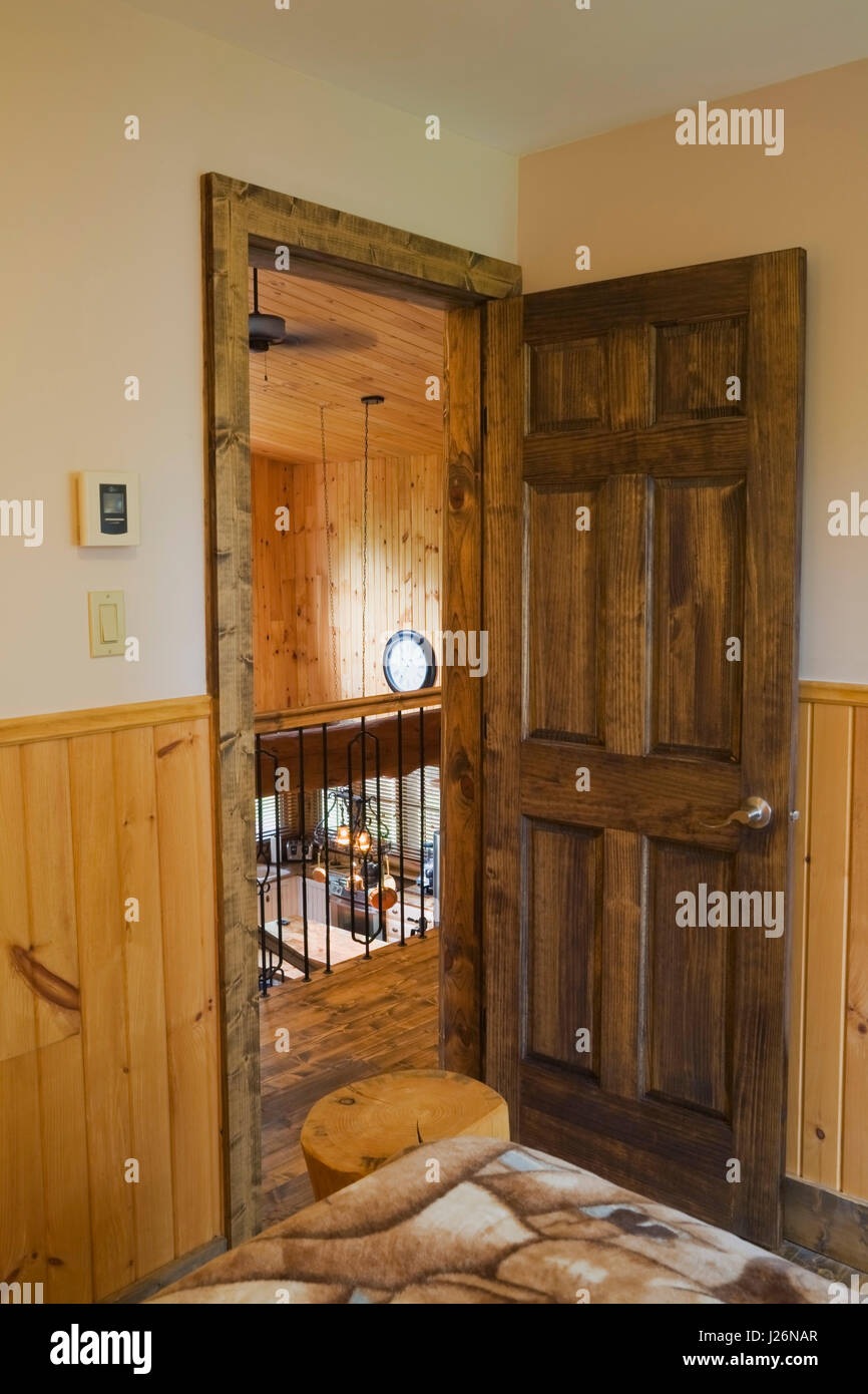 View of the downstairs kitchen through an opened upstairs bedroom door ...