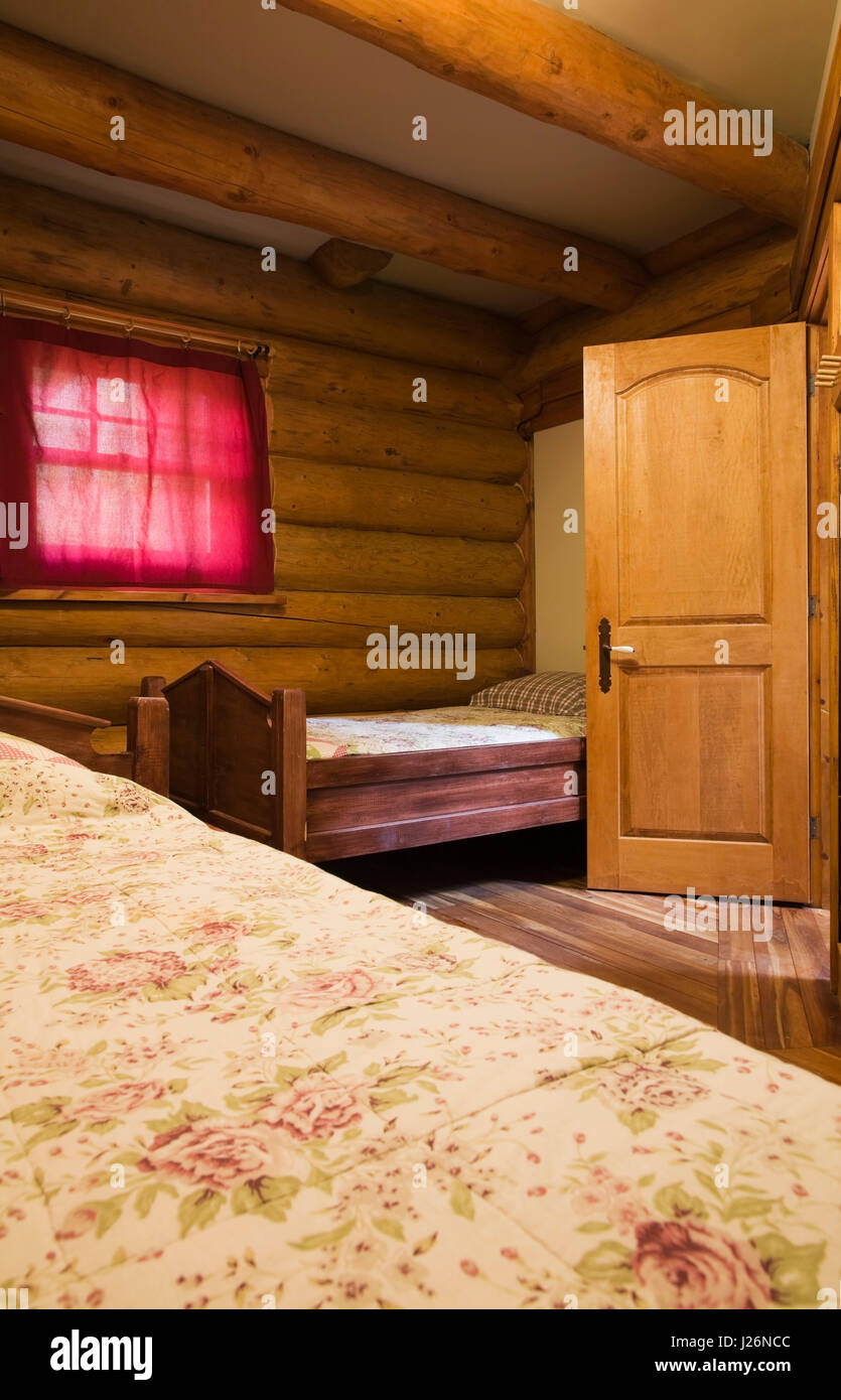 Guest bedroom inside a 2003 built cottage style residential log home ...
