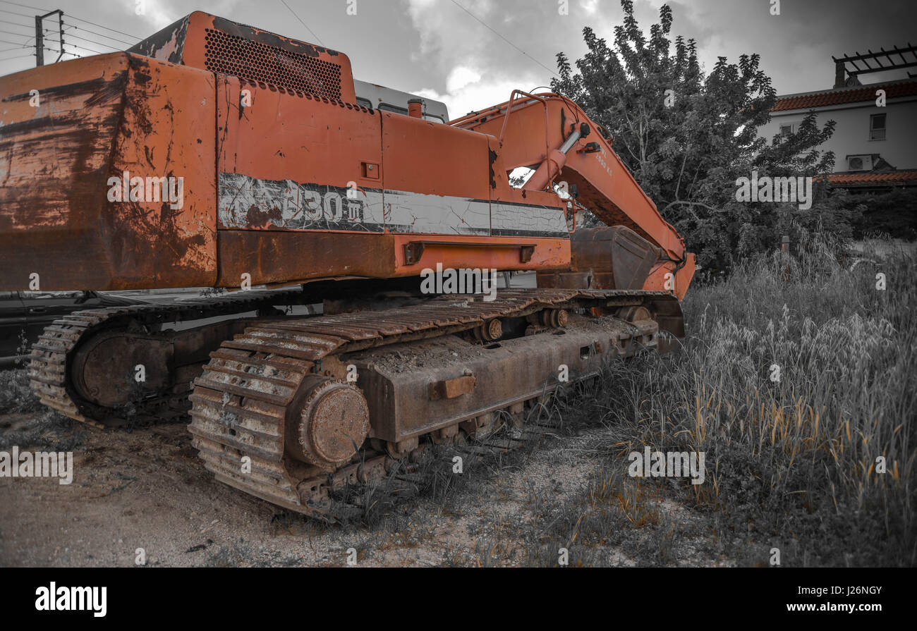 old building digger now rusting Stock Photo - Alamy