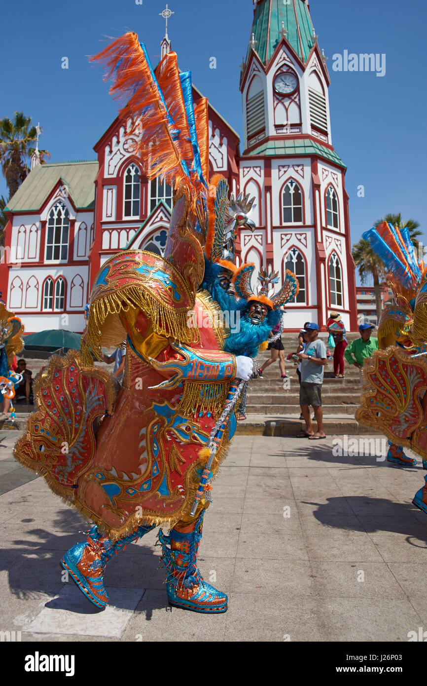 Masked Morenada Dancer dressed in an ornate costume performing during a ...