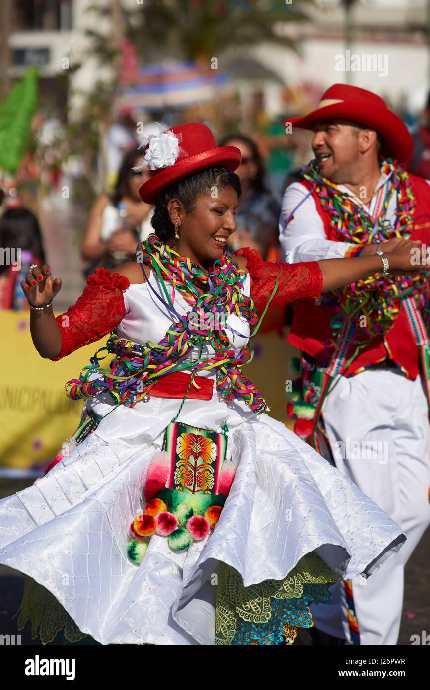 Female member of a Pueblo dance group in ornate costume performing at ...