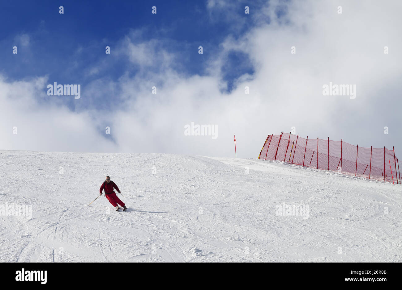 Skier on ski slope at nice sun day. Greater Caucasus Mountains, Mount ...