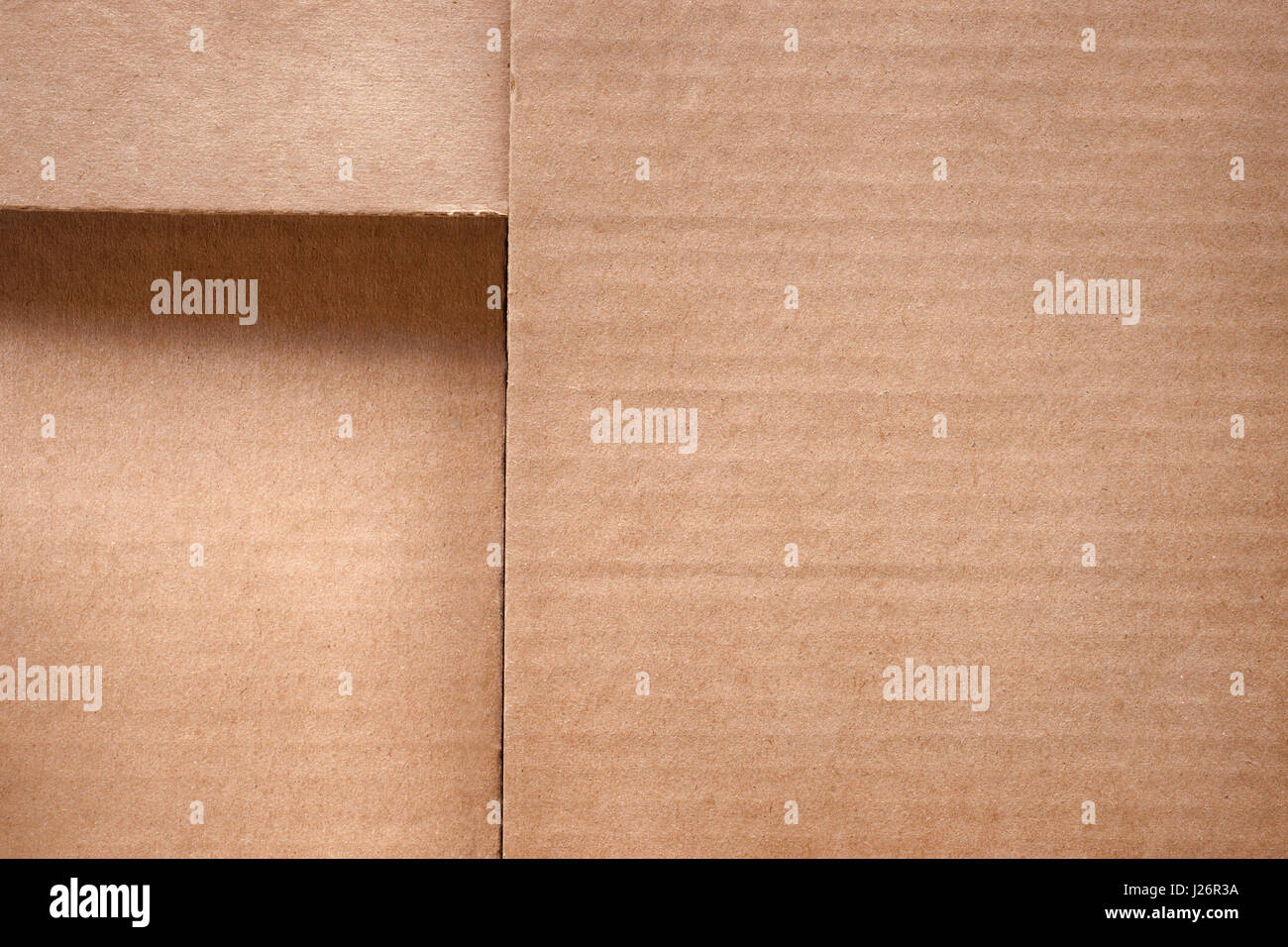 Folded cardboard box cover close up. Texture and background with copy ...