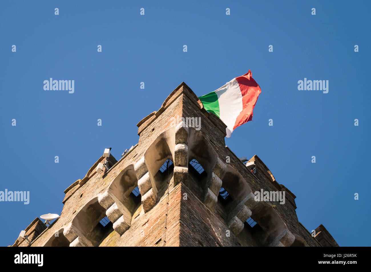 Tower of a castle from below, on which waves the Italian flag Stock ...