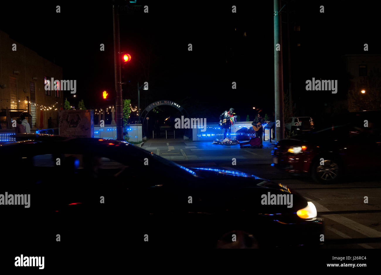 Flowers, notes and necklaces adorn the statue of Rock and Roll Hall of ...