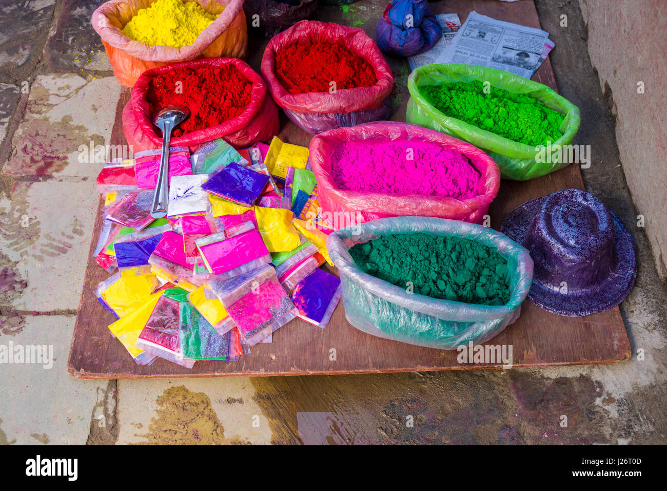 Small packs of color powder are sold in the streets for the Holi ...