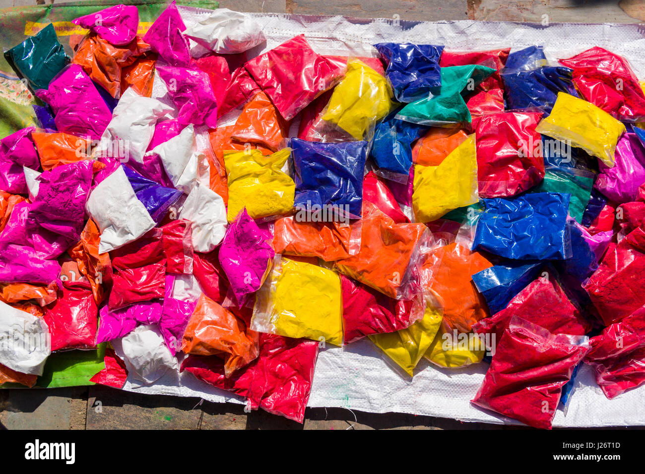 Small packs of color powder are sold in the streets for the Holi ...