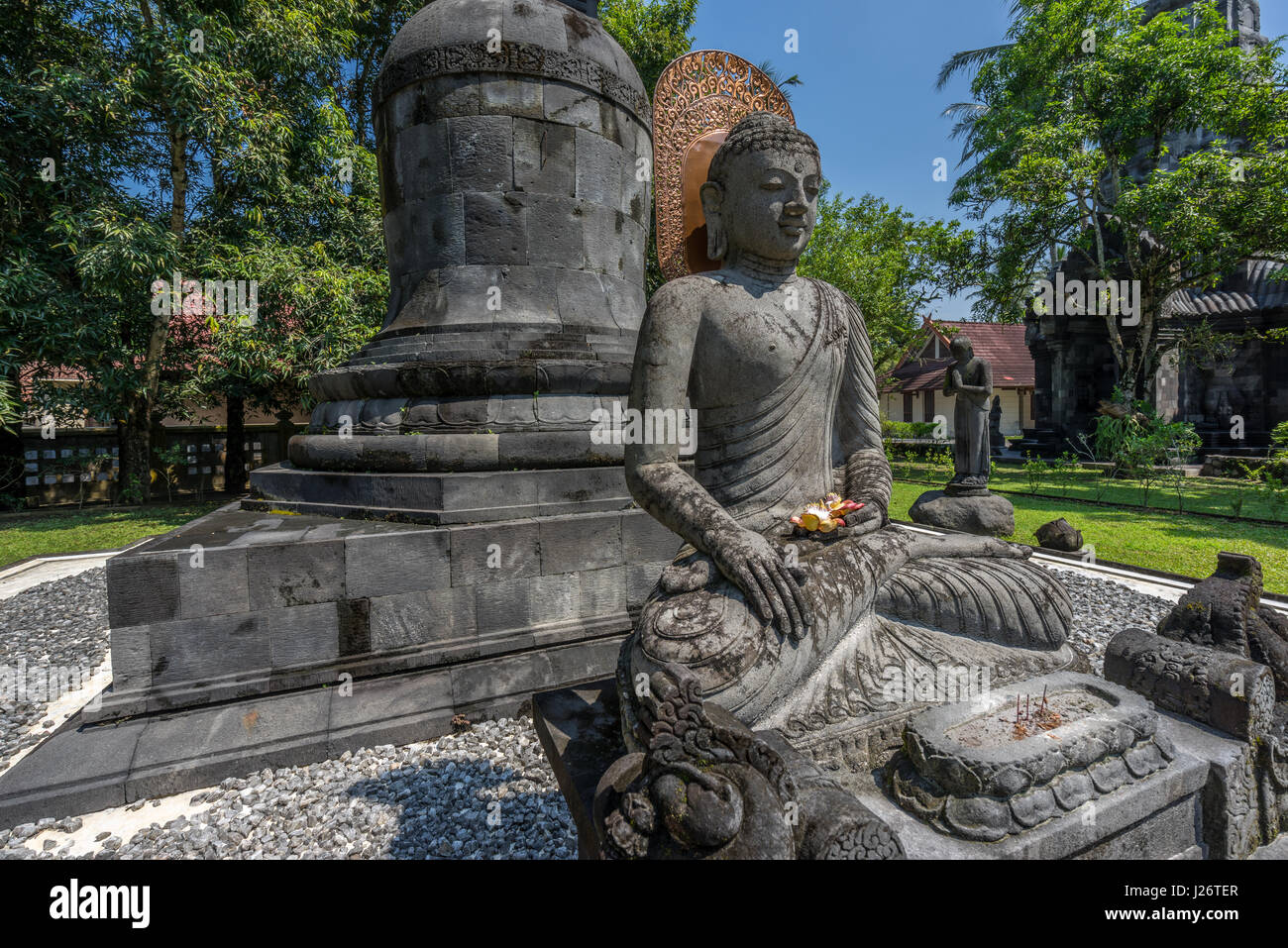 Buddha stone statue in the Bhumisparsha Mudra or gesture. Mendut ...
