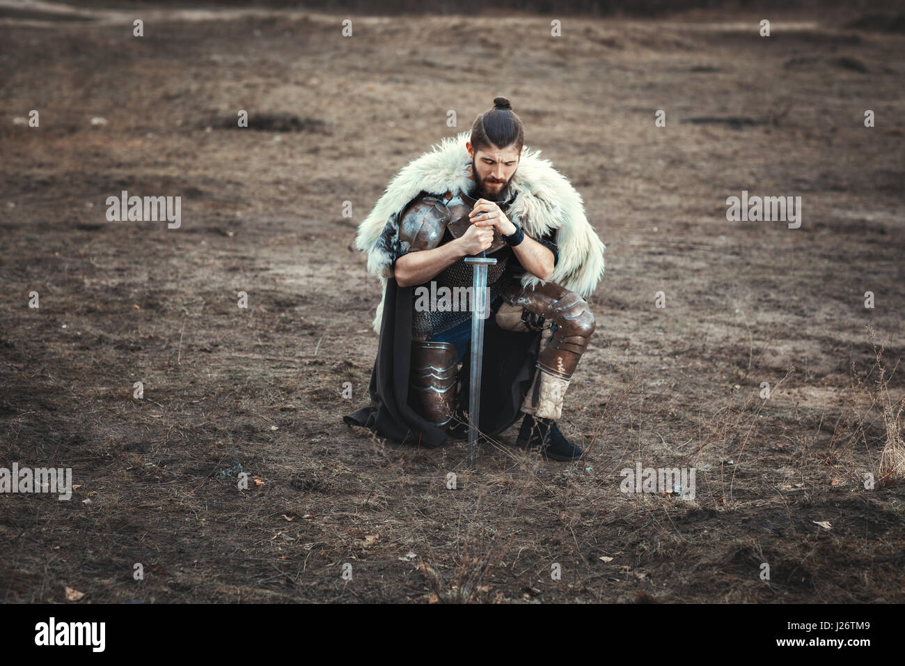 Formidable man with a sword in the sad, he had iron armor Stock Photo ...