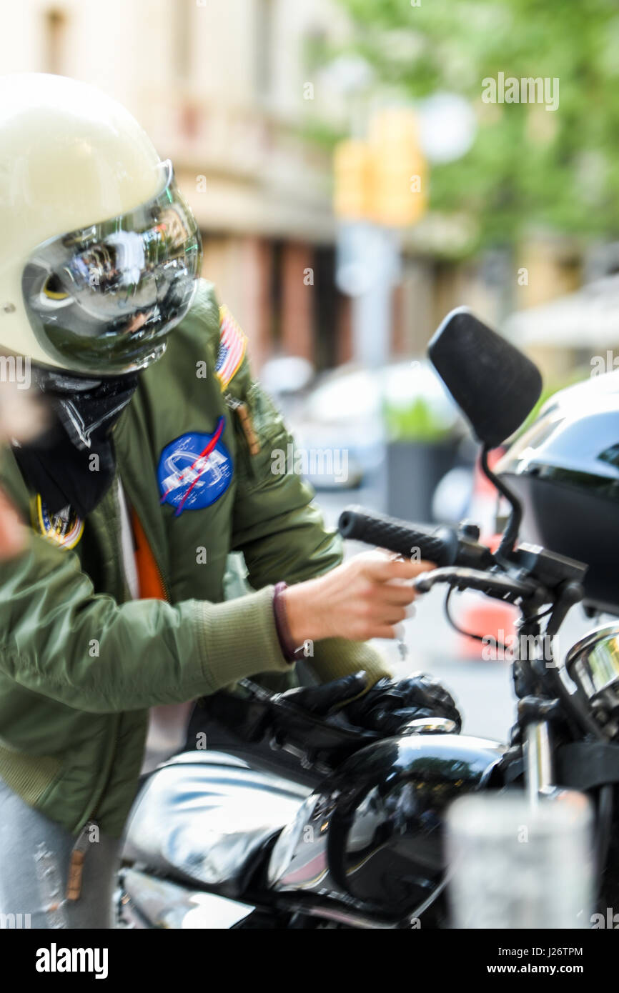 Guys on a motorcycle with helmets on Stock Photo - Alamy