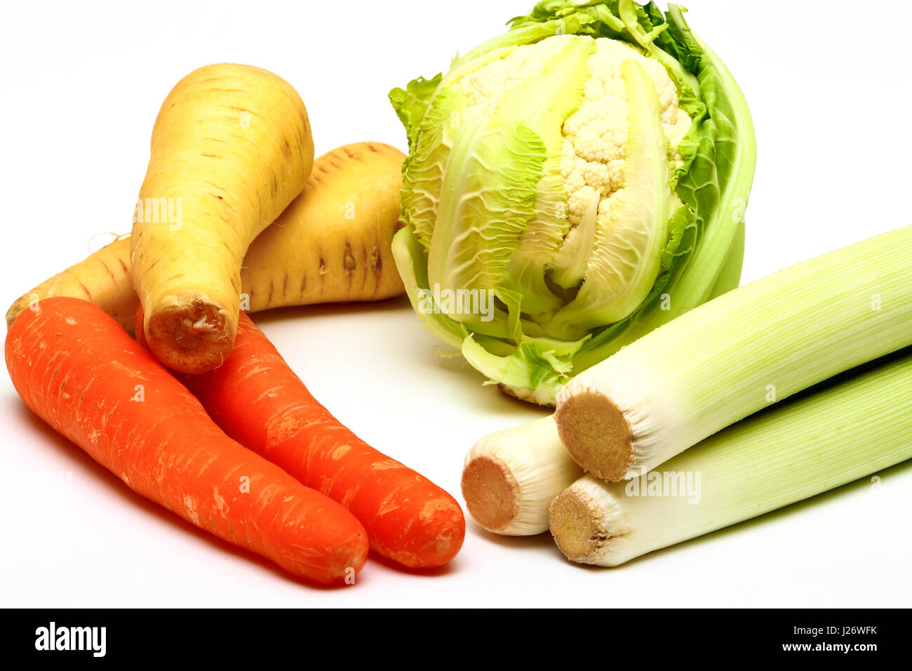 Collection of raw organic root vegetables including carrots,leeks ...