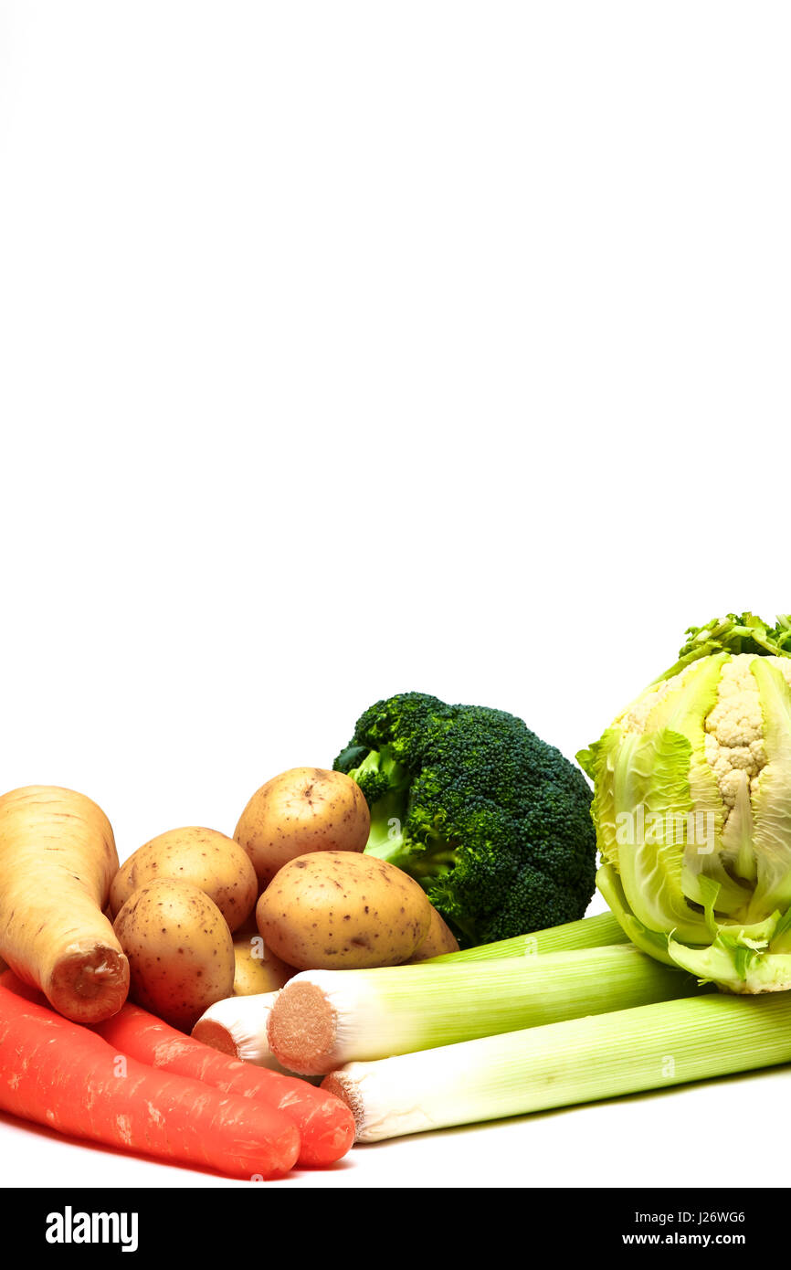 Collection of raw organic root vegetables including potatoes , carrots ...