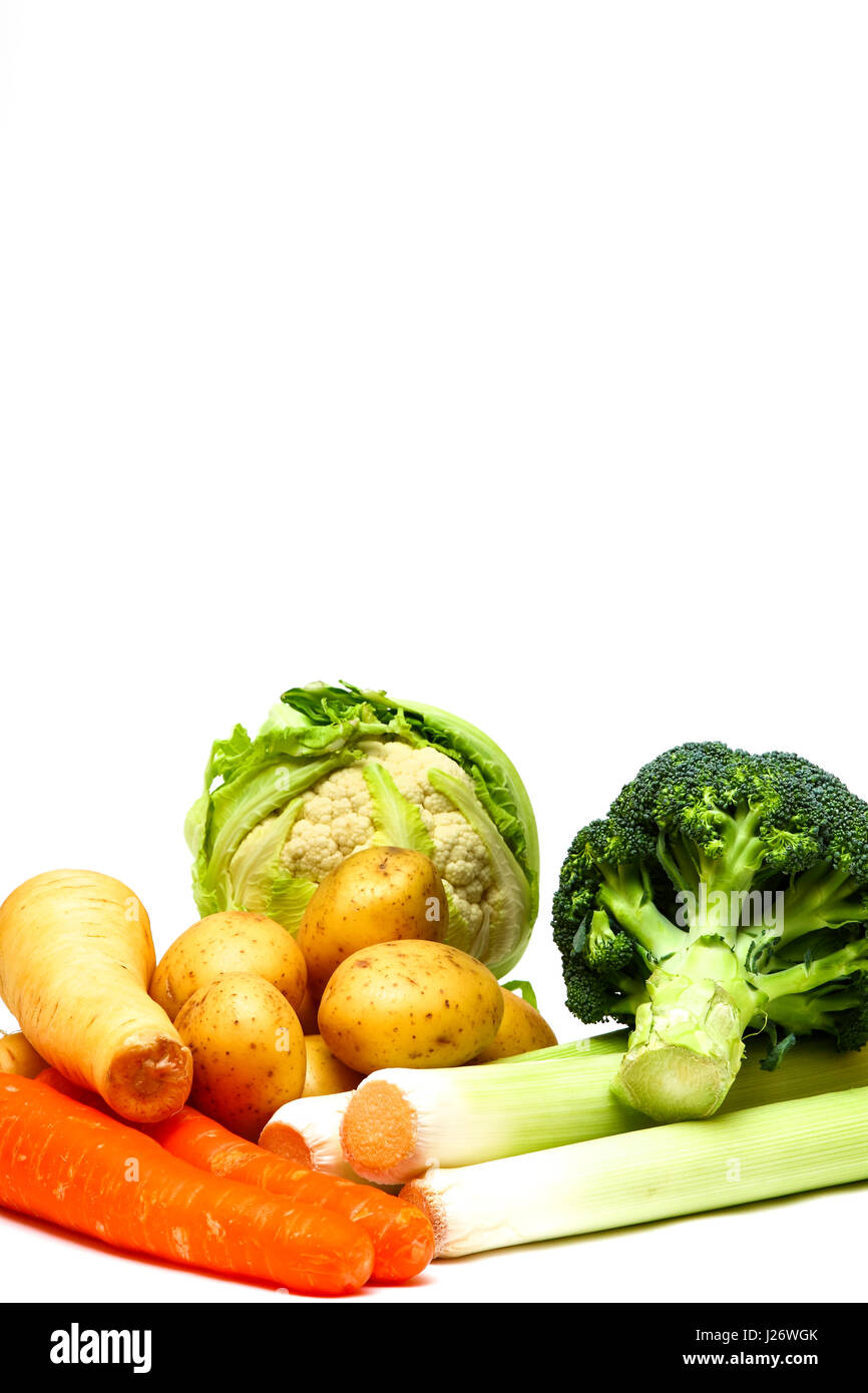 Collection of raw organic root vegetables including potatoes , carrots ...