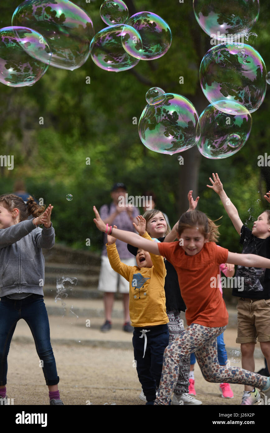 KIds blowing bubbles Stock Photo - Alamy
