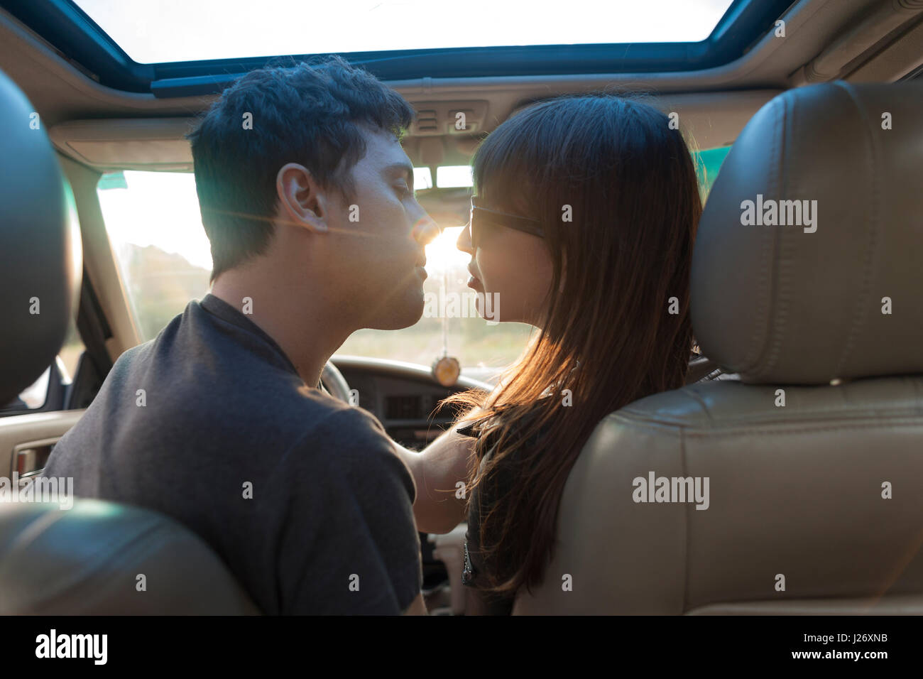 Young couple on a road trip Stock Photo - Alamy