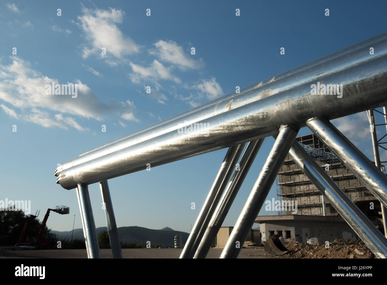 Steel tubes building materials detail with under construction building ...