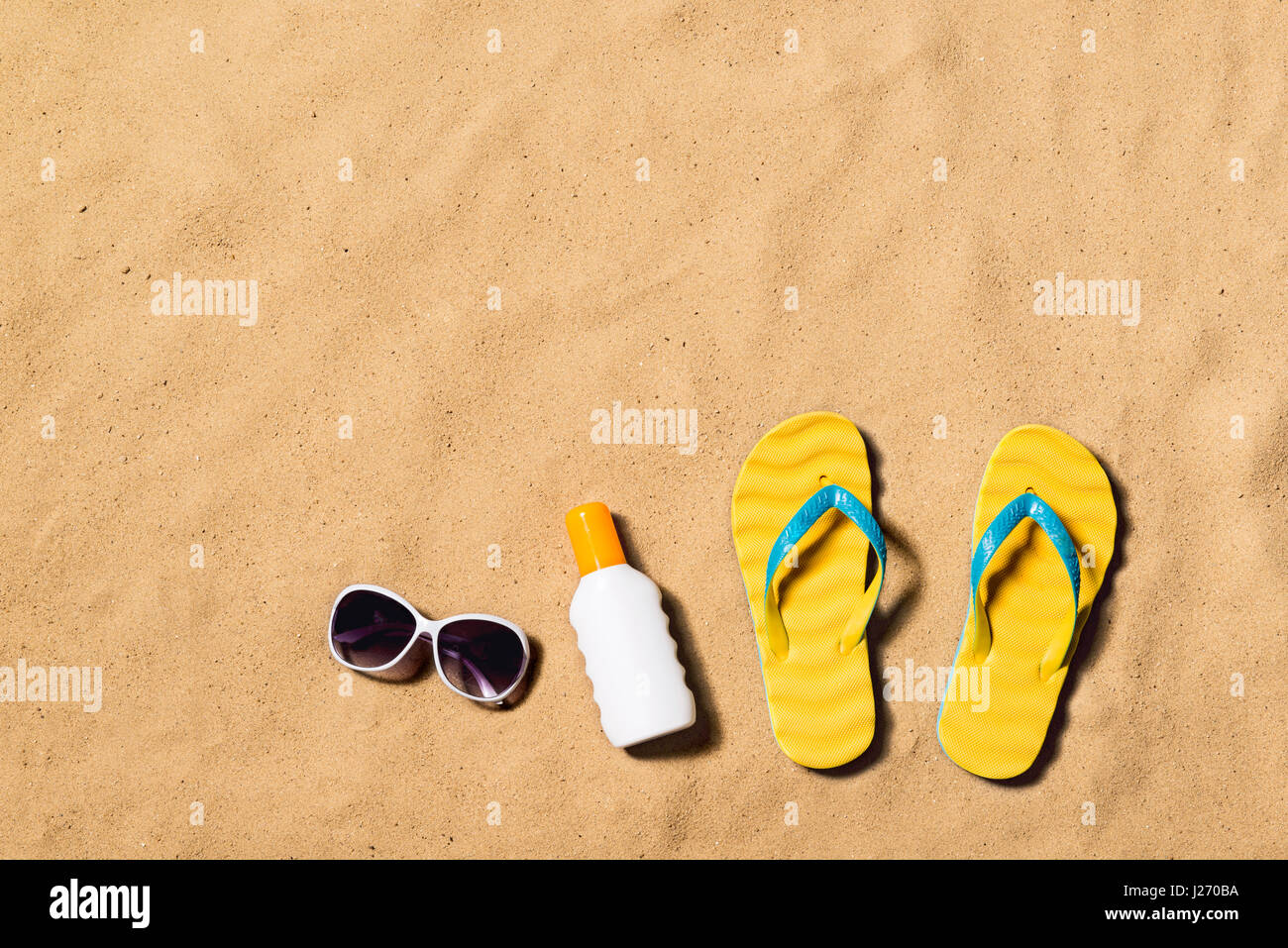 Summer vacation composition. Flip flops, sunglasses and sunscree Stock ...