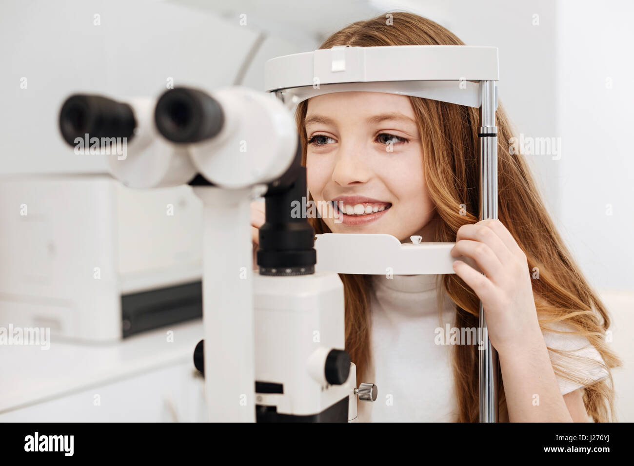 Adorable girl getting her eyes checked Stock Photo - Alamy