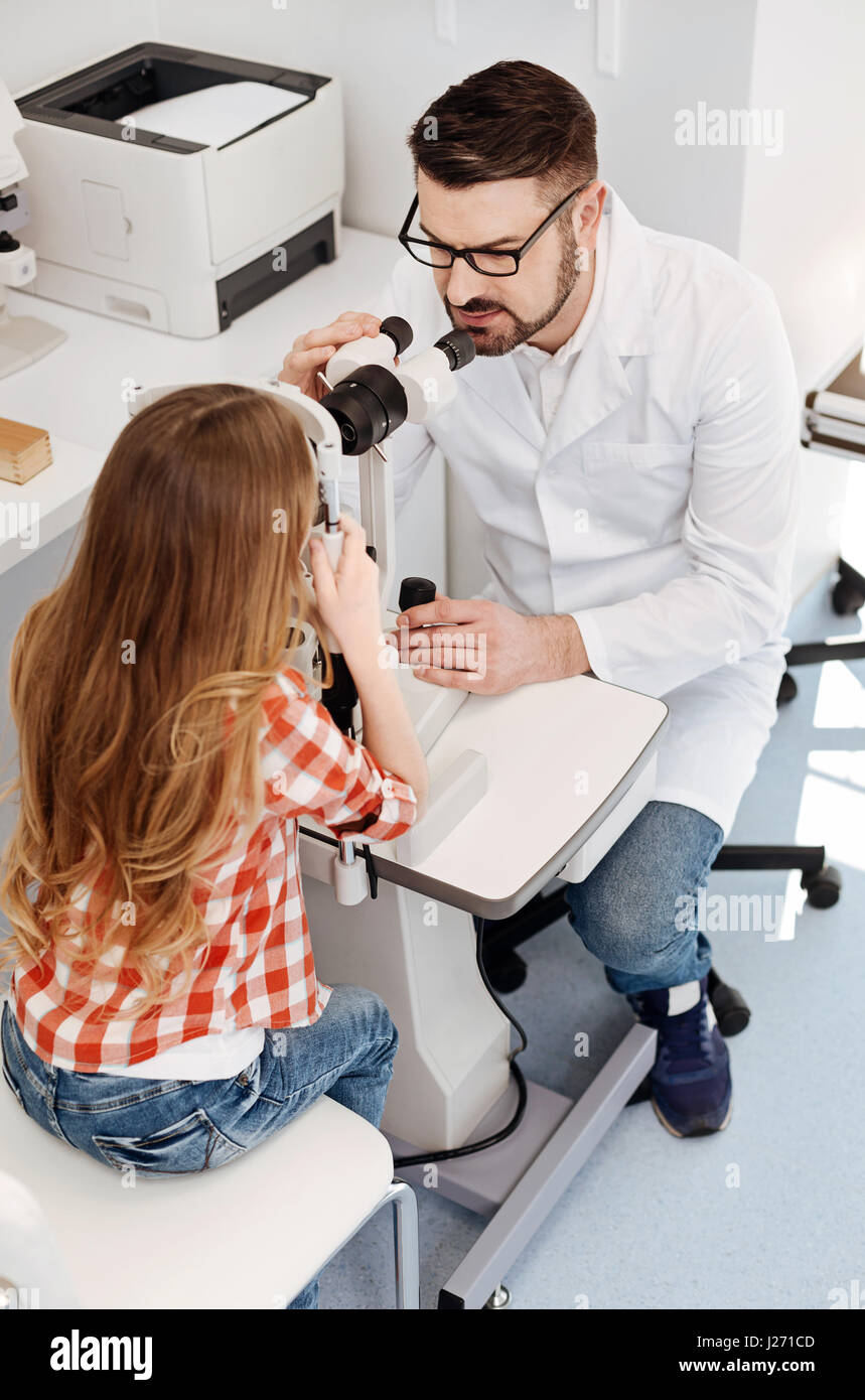 Trained experienced doctor adjusting the equipment Stock Photo - Alamy