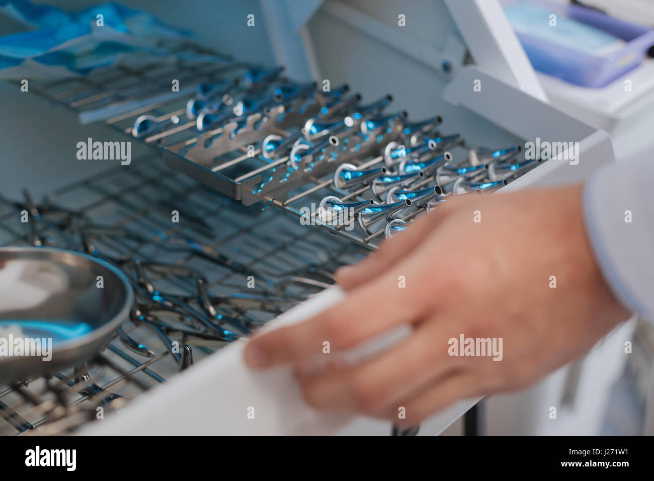 Let me choose. Professional doctor standing near medical instruments ...