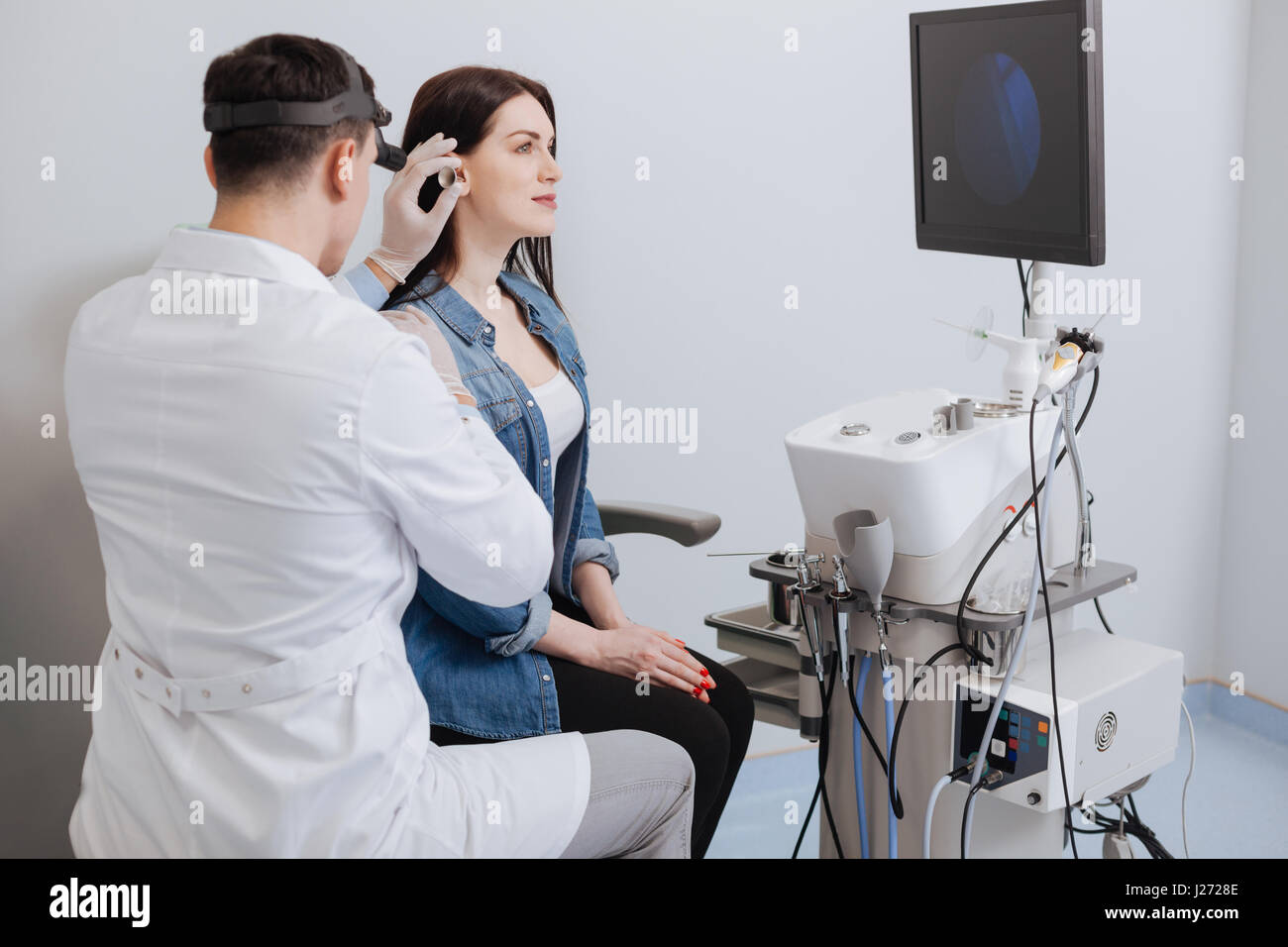 Side view of medical examination leading be ENT specialist Stock Photo ...