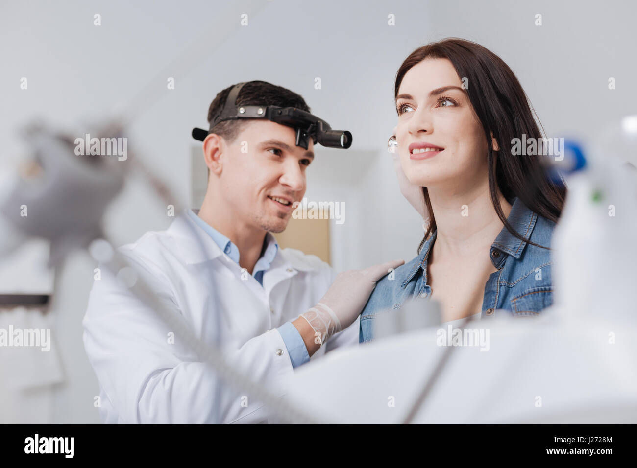 Smiling medical worker using special tools Stock Photo - Alamy