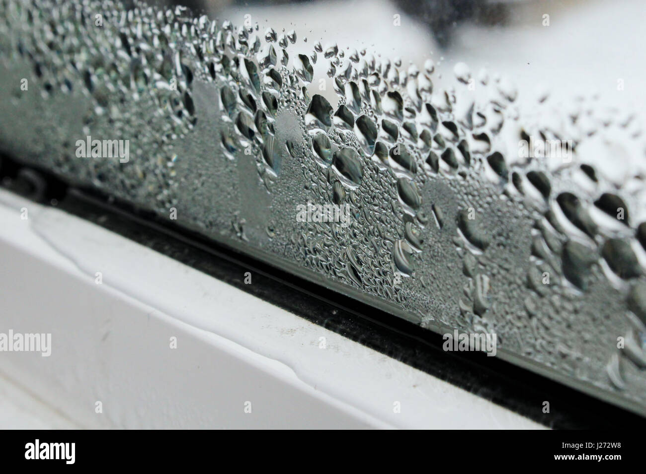 Water pooling on window still Stock Photo - Alamy